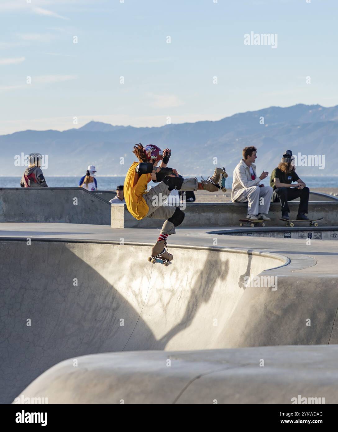 A picture of a roller skater doing a jump trick on the Venice Beach ...