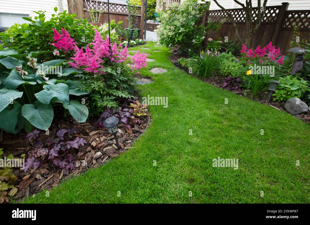 Beautiful garden path leads to street Stock Photo - Alamy