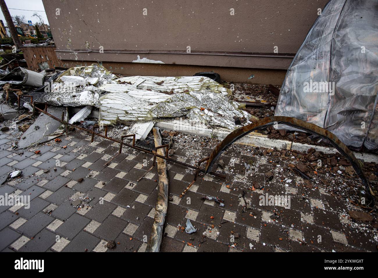 Shows a scene of destruction with shattered concrete and debris ...