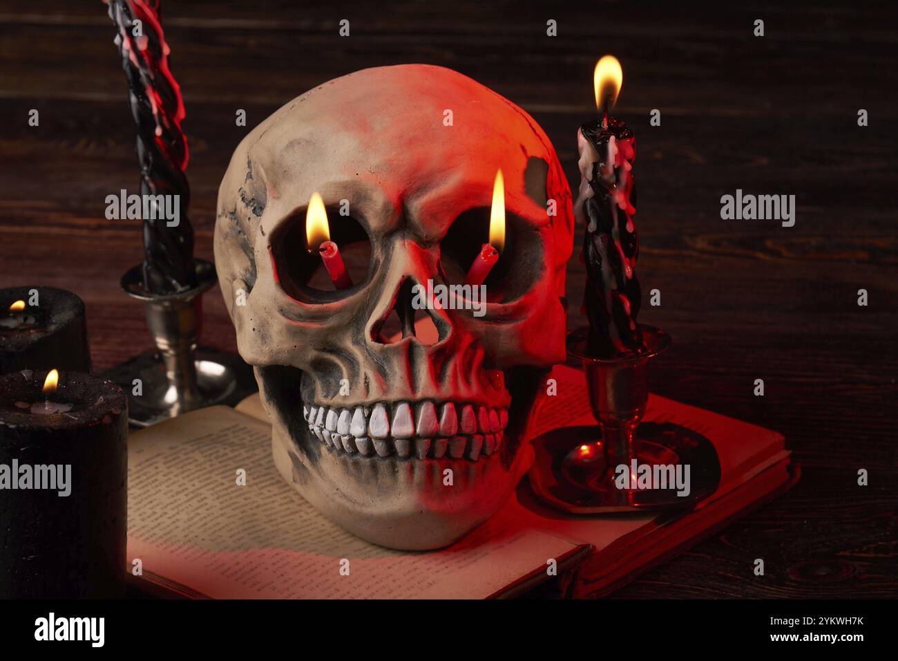 Composition of burning candles in the ancient humans skull. Death and ...