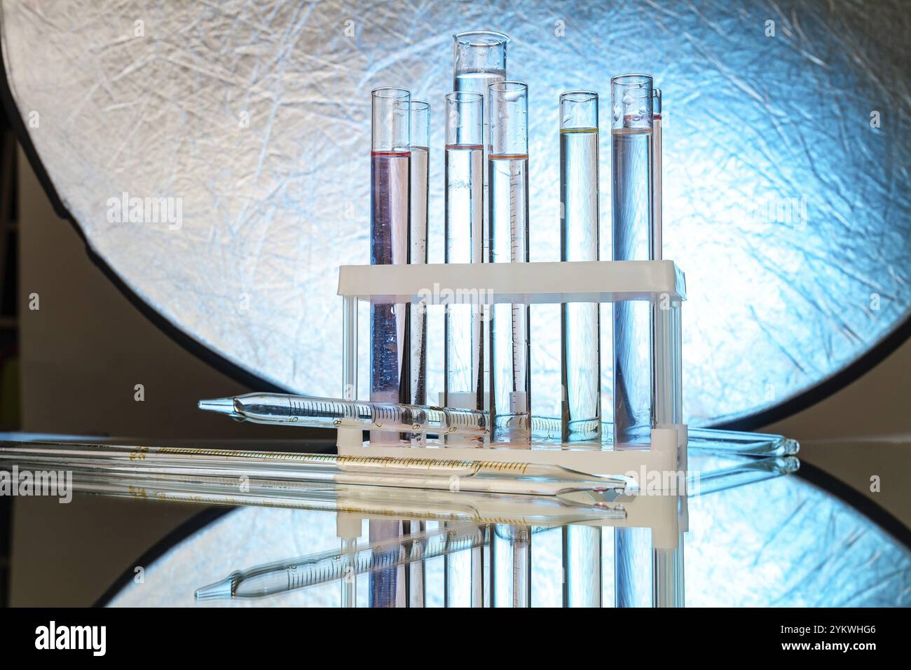 Set of lab test tubes filled with transparent liquid. Lab equipment for ...