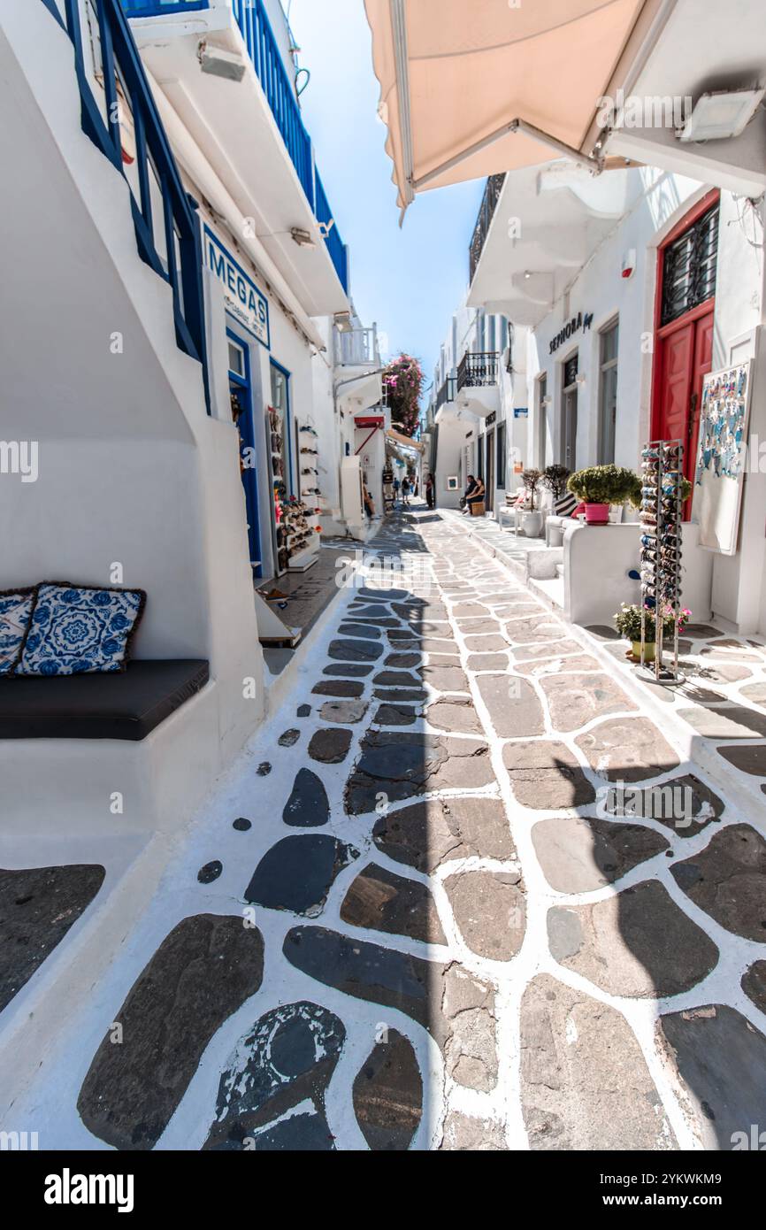 Whitewashed alley with stairs and colorful doors and windows in Mykonos ...