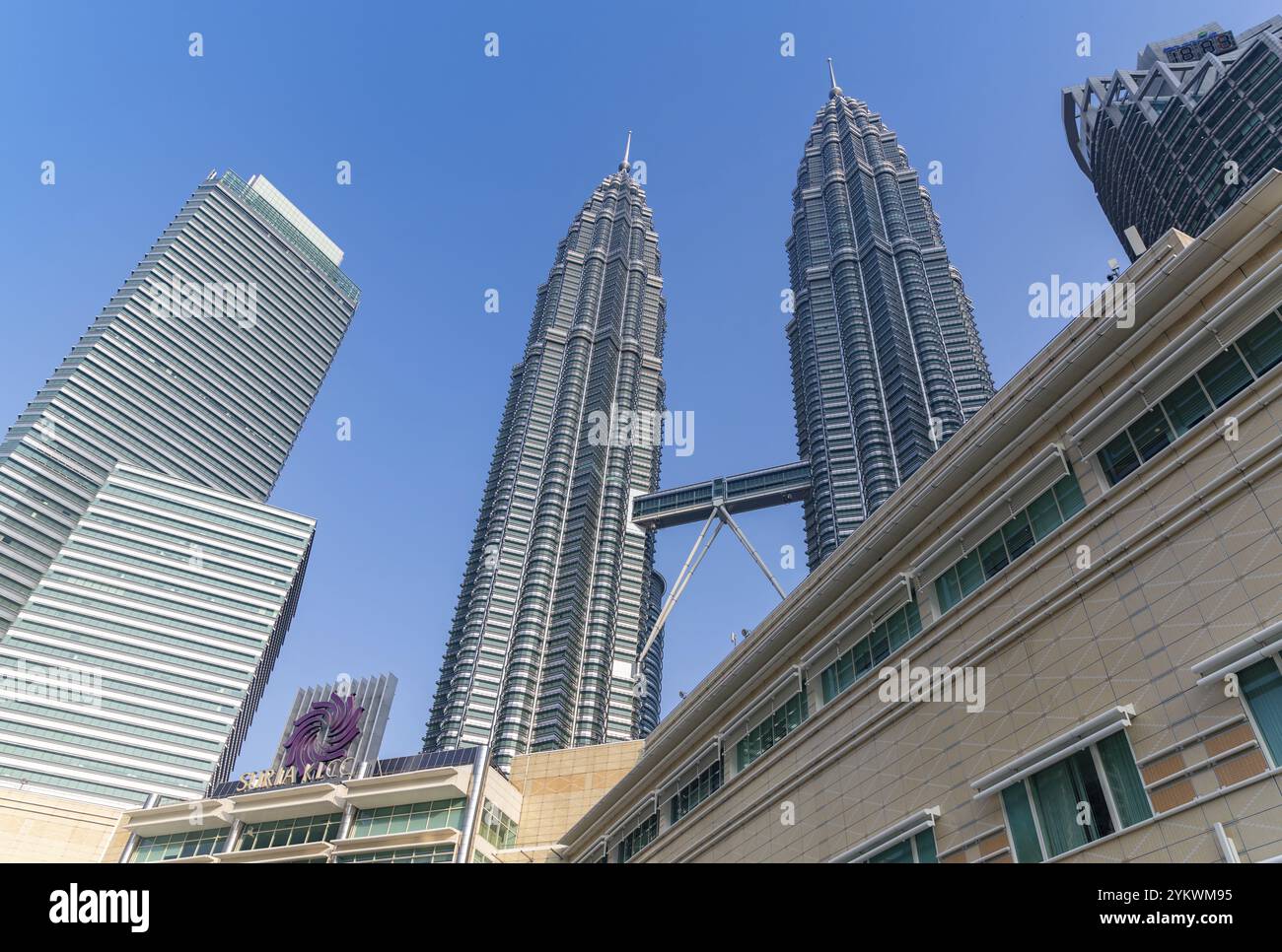 A picture of the Petronas Twin Towers rising above the Suria KLCC ...