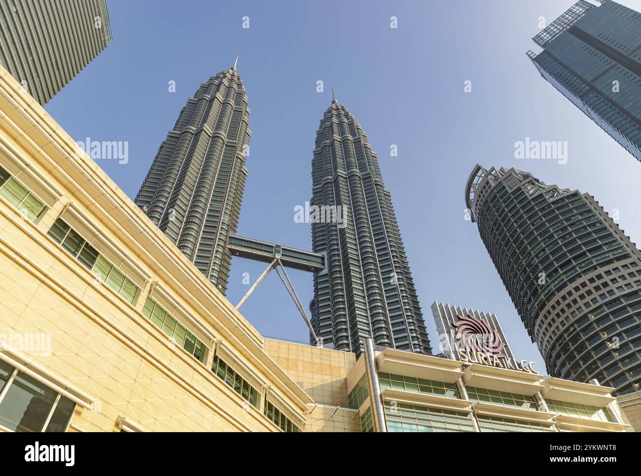 A picture of the Petronas Twin Towers rising above the Suria KLCC ...