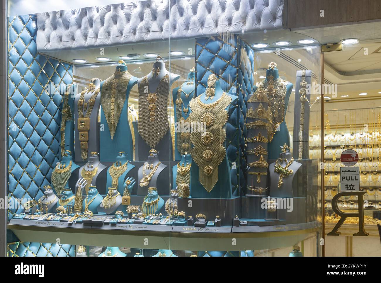 A picture of women's jewelry on a storefront at the Dubai Gold Souk ...