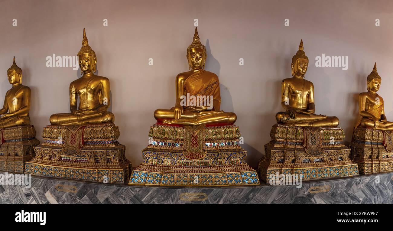 A picture of golden Buddha statues at the Wat Pho Temple Stock Photo ...