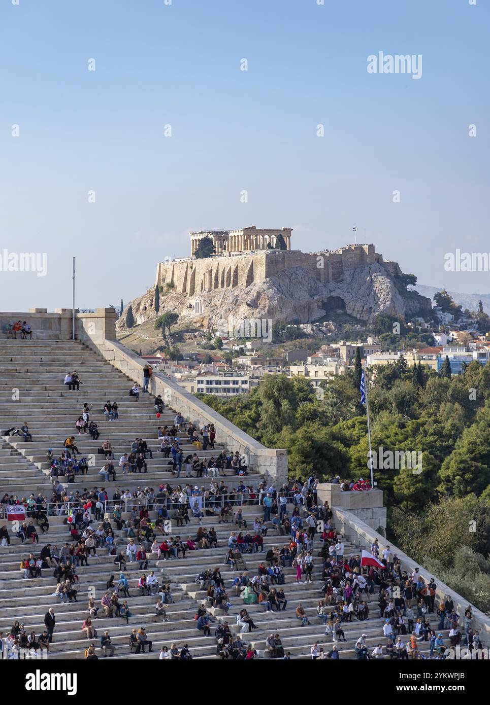 A picture of a crowded Panathenaic Stadium, and the Acropolis of Athens ...