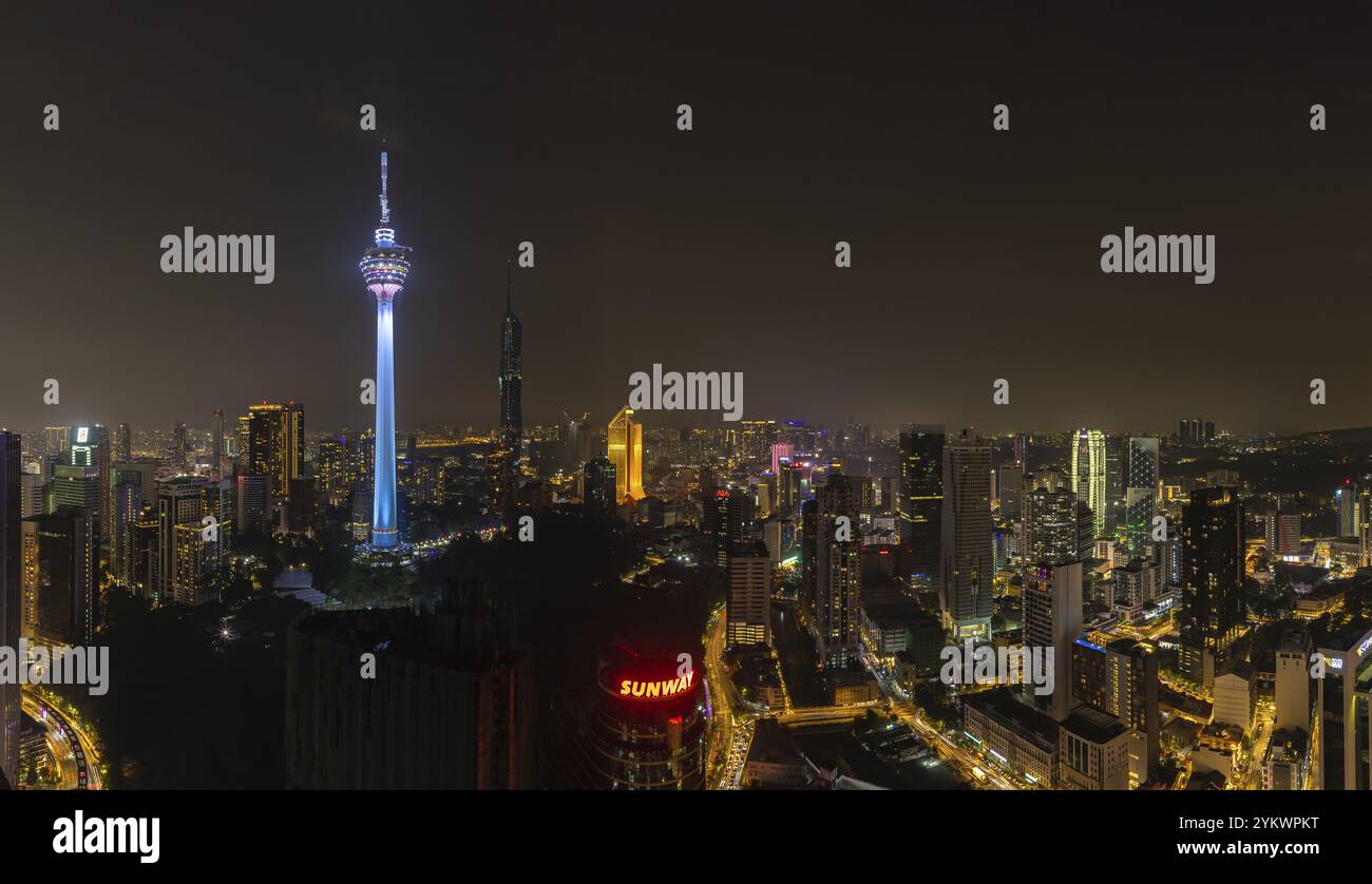 A picture of the Kuala Lumpur cityscape at night, with the Menara Kuala ...