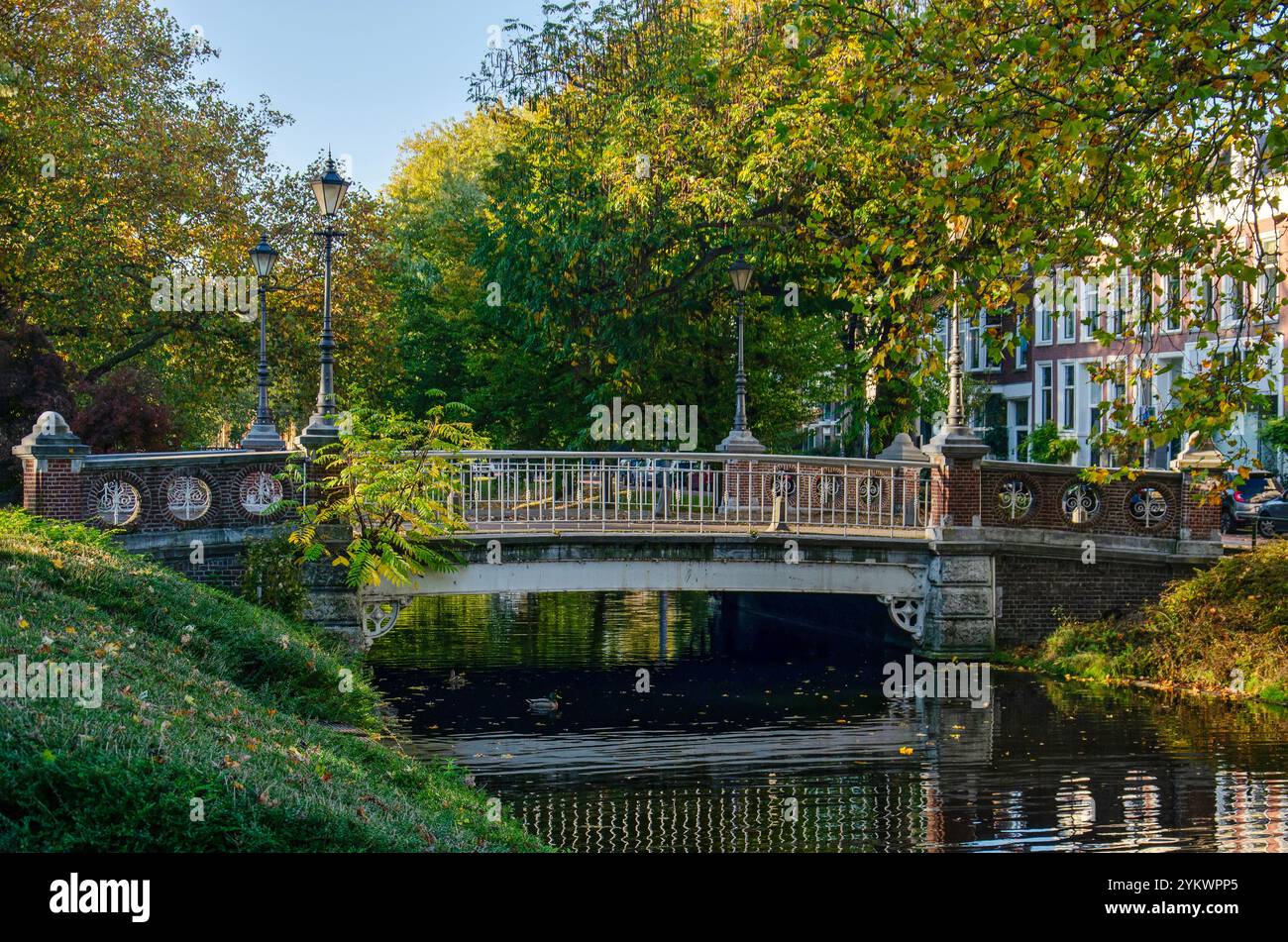 Historic bridge made of brick, stone and steel across Noordsingel canal ...