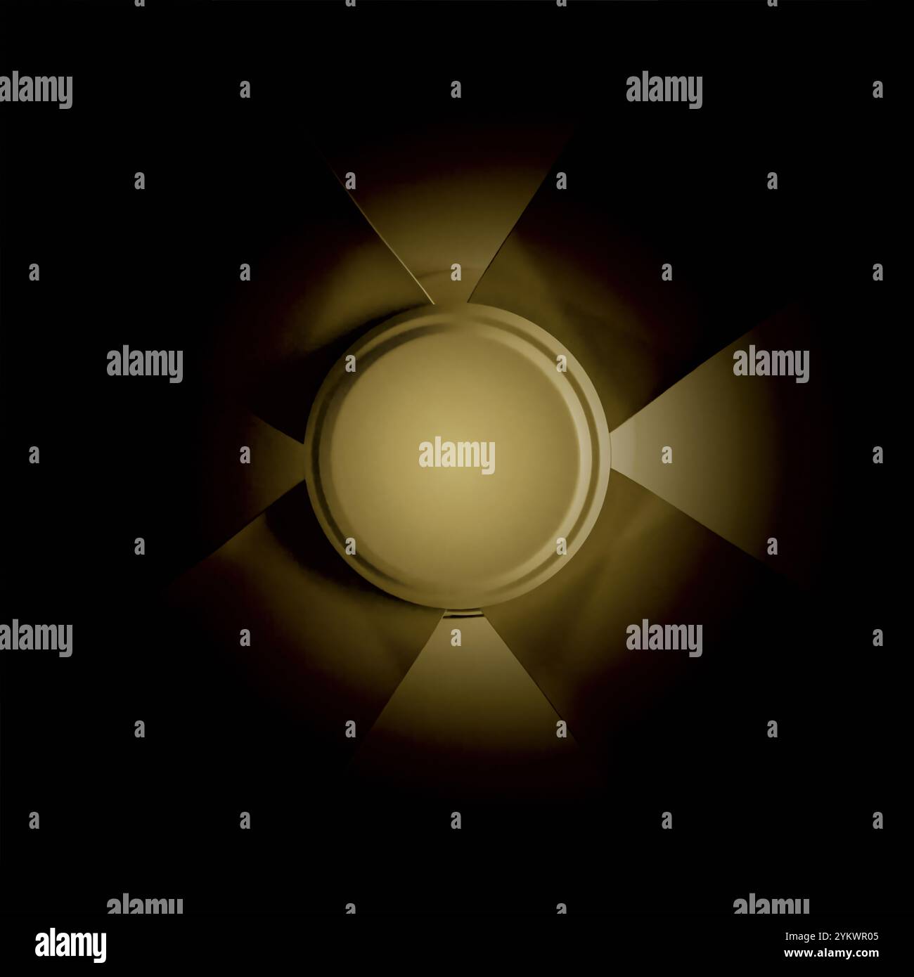 Yellow ceiling fan in the dark. It can be used as a sign representing ...