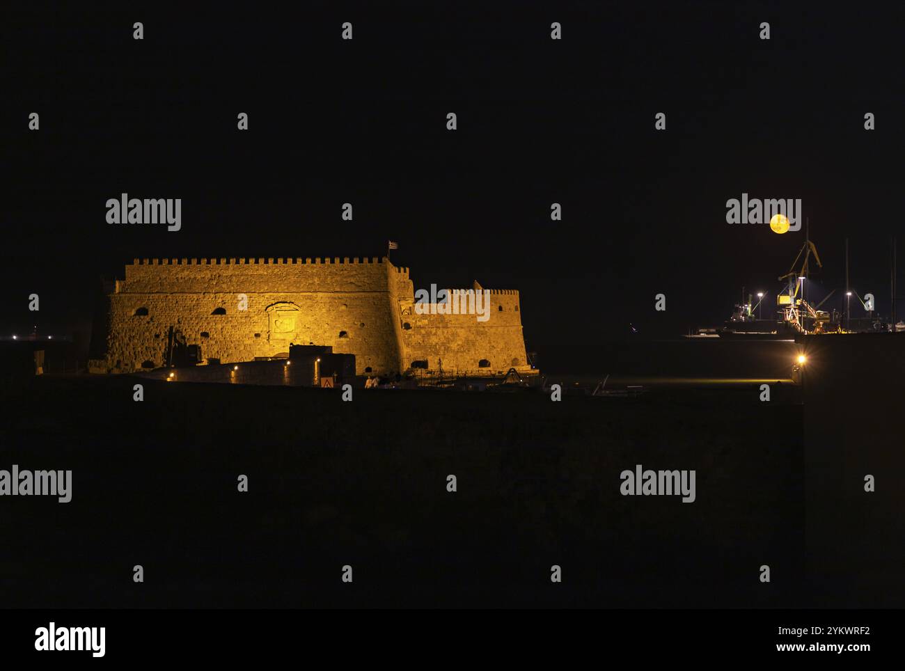 A picture of the Rocca a Mare or Koules Fortress at night, with a red ...