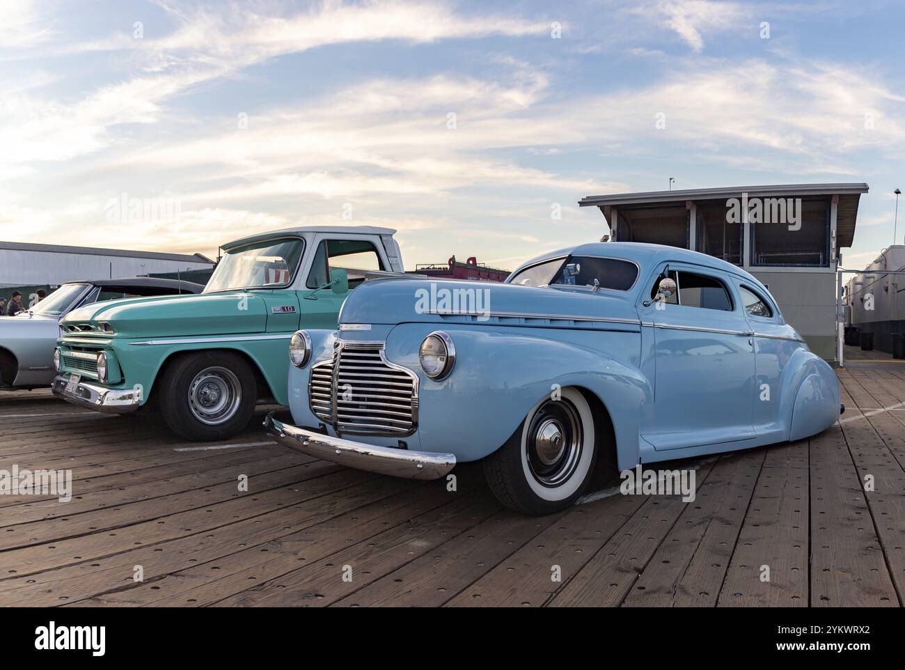 A picture of a light blue Chevrolet Master Deluxe and a green Chevrolet ...