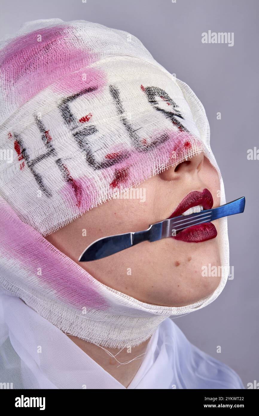 Bandaged head with blood stains after surgery. Young woman with scalpel ...