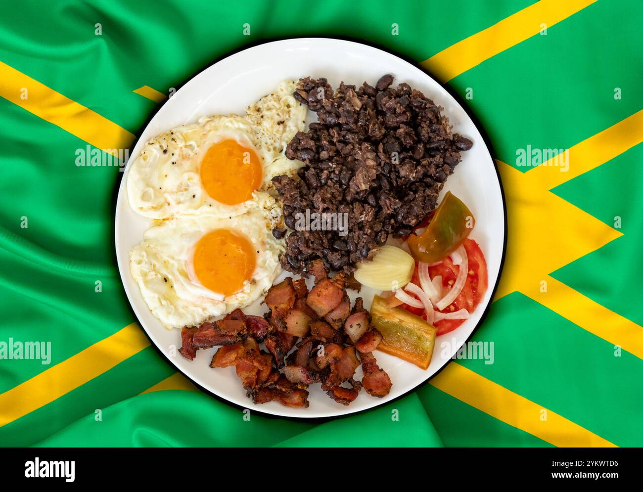 Traditional Brazilian everyday food, black bean stew, bacon, egg, salad ...