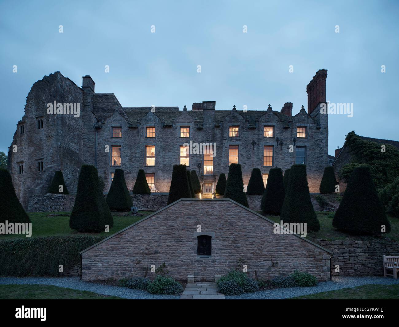 Dusk view from park with illuminated interiors. Hay Castle, Hay-on-Wye ...