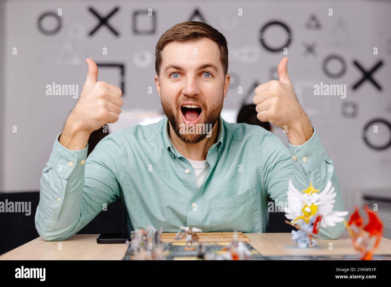 Man with board game piece while practicing strategy in home alone. A ...