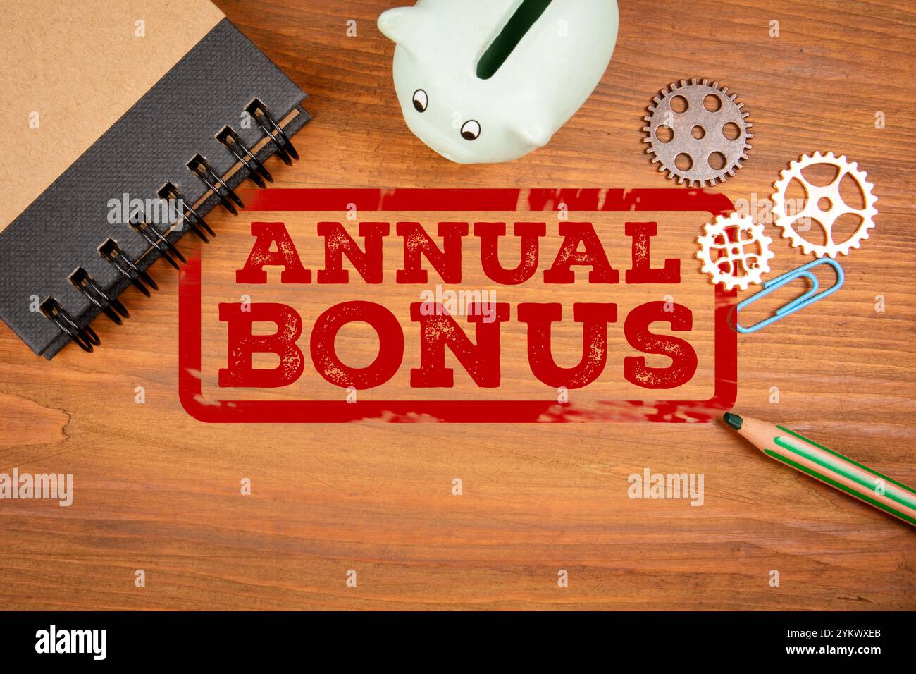 Annual Bonus. Text printed with a stamp on a wood texture background ...