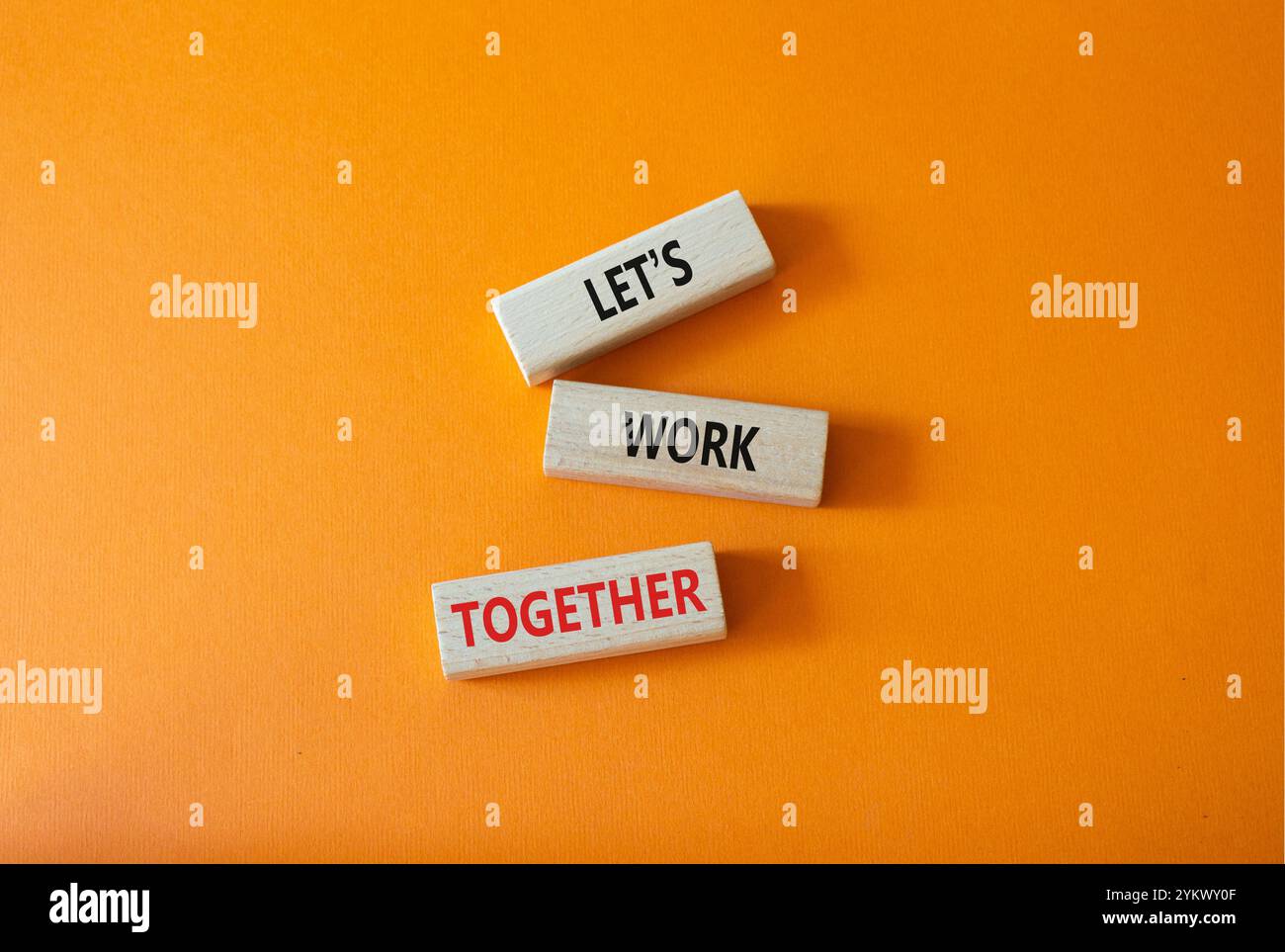 Lets work together symbol. Concept words Less is More on wooden blocks ...