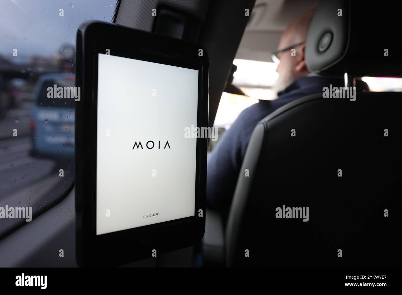 Hamburg, Germany. 18th Nov, 2024. The logo of Moia GmbH can be seen on a small screen during a ...