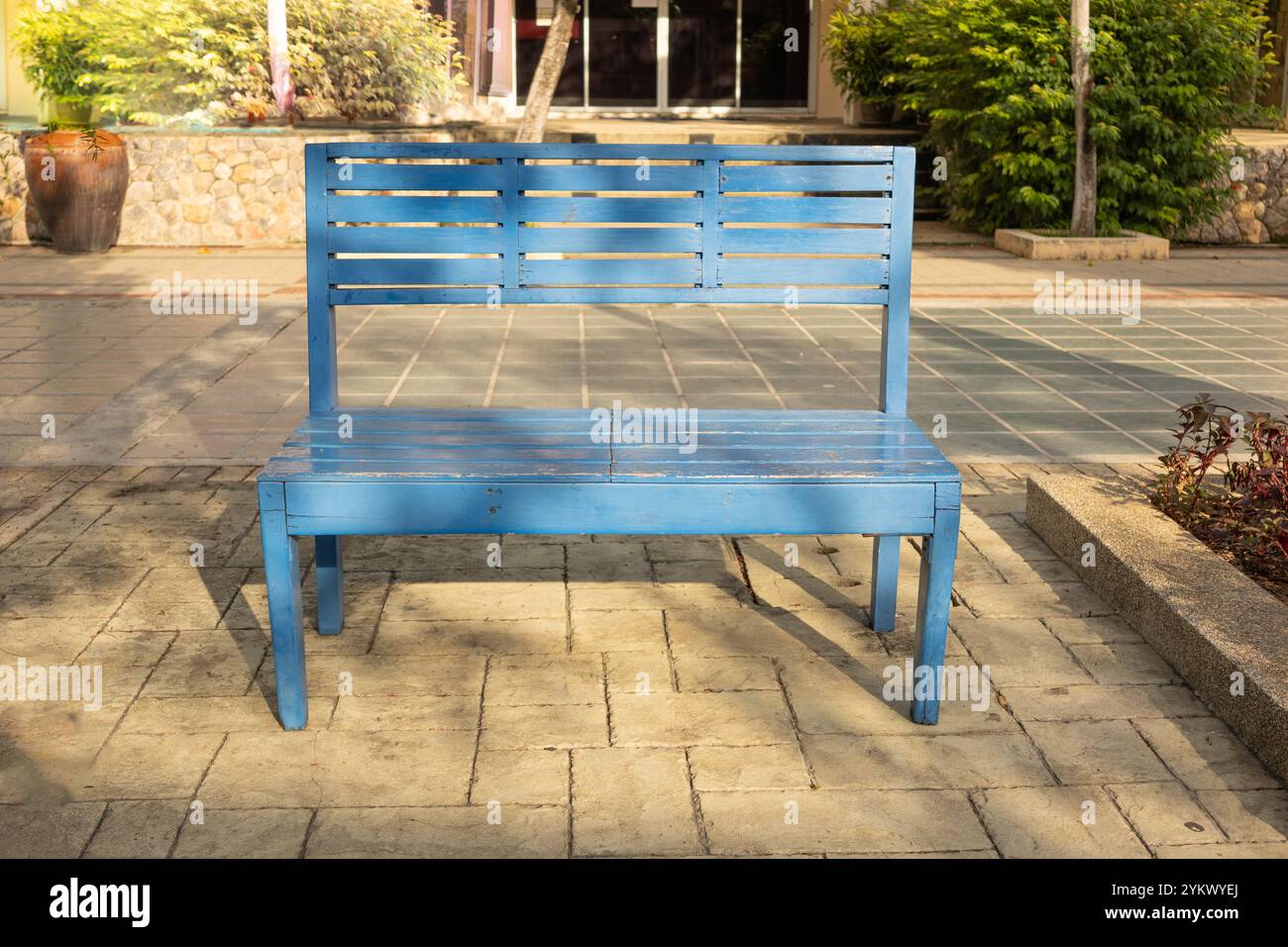 Bench in front of brick house hi-res stock photography and images - Alamy
