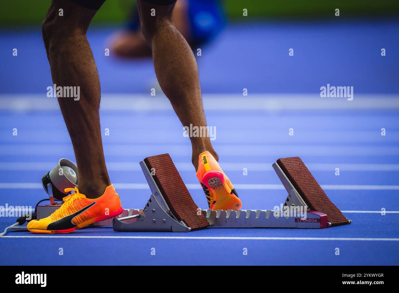 Orange Puma athletic shoes in the 400 meters at the Paris 2024 Olympic ...