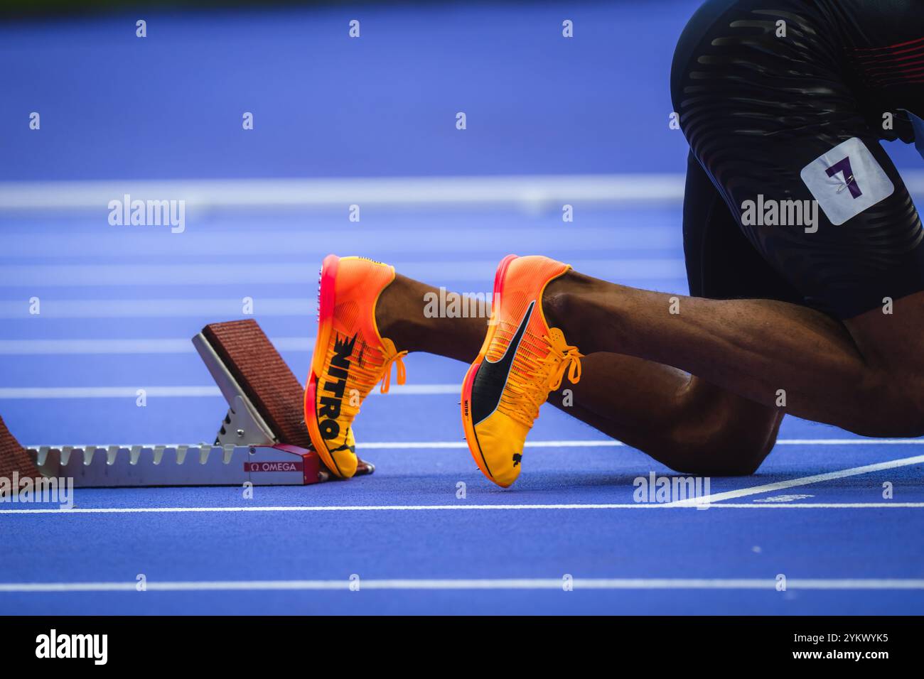 Orange Puma athletic shoes in the 400 meters at the Paris 2024 Olympic ...