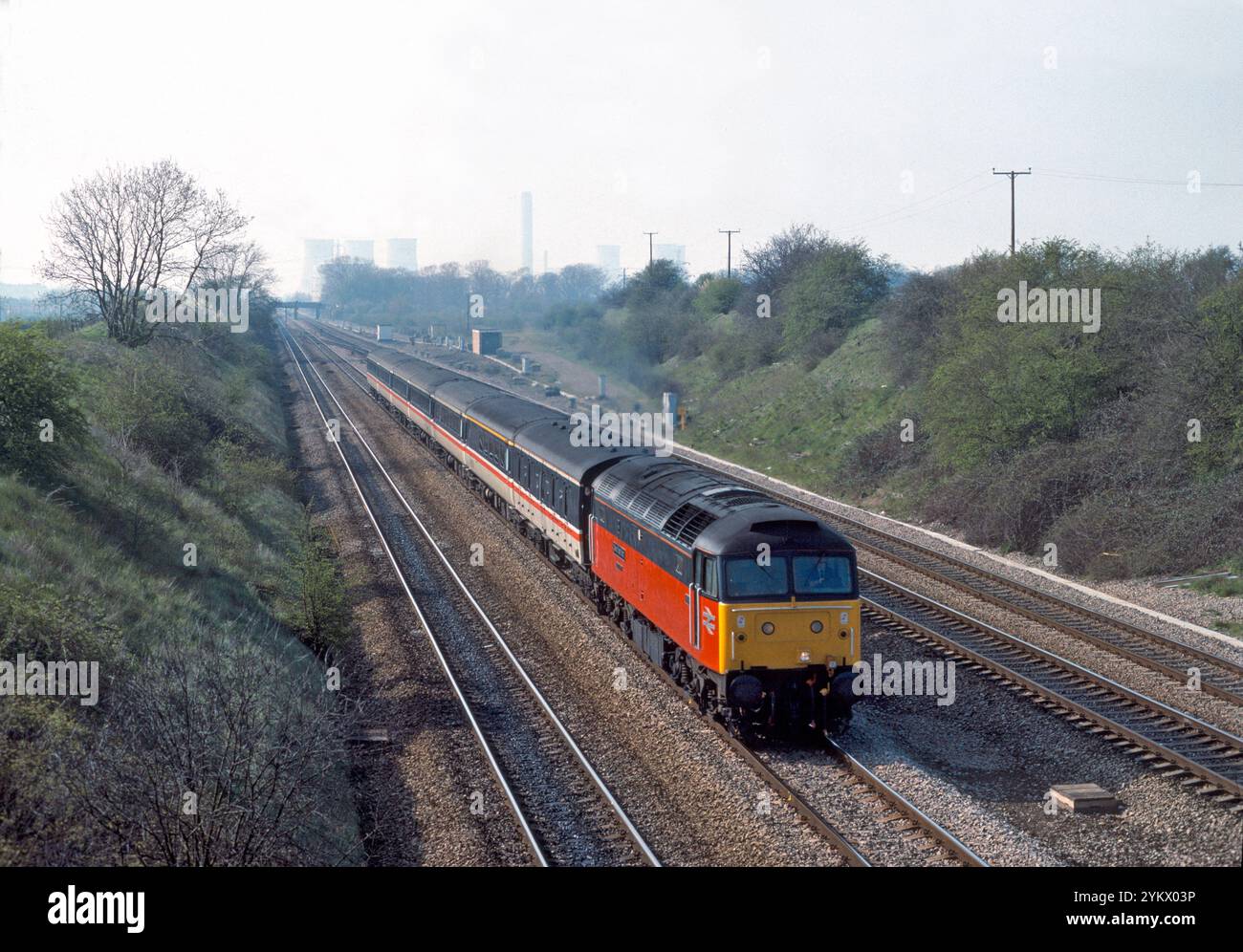 A Class 47 diesel locomotive number 47489 in the parcels red livery ...
