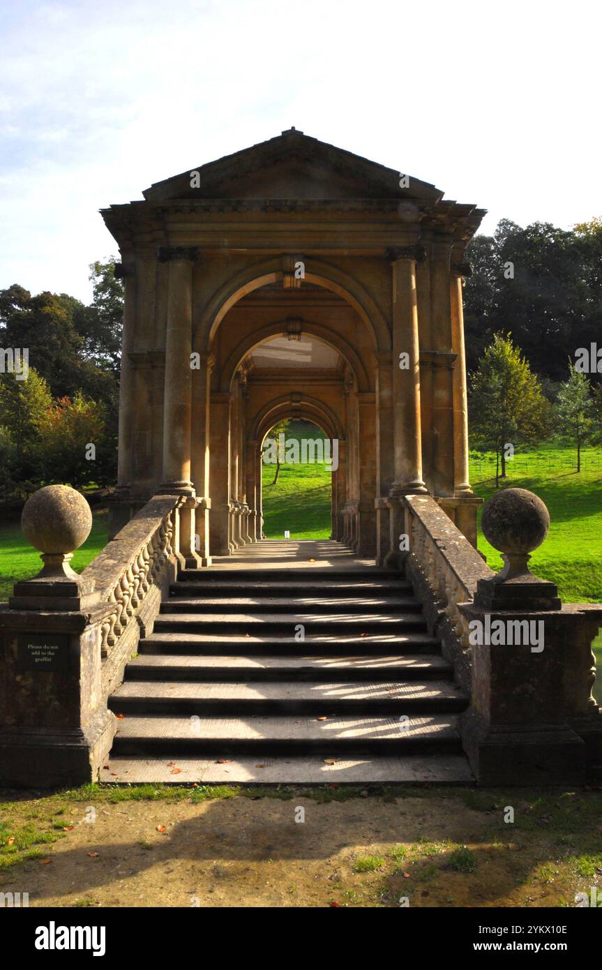 The Palladian bridge, in the autumn sunshine, over the lake in Priory ...