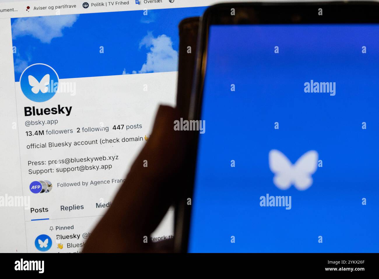 This photo illustration, the Bluesky logo is displayed on a smartphone ...