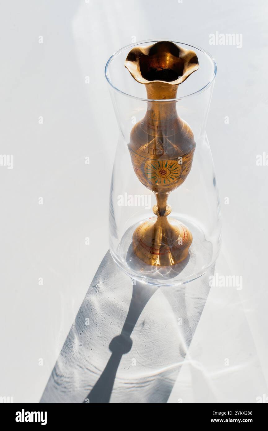 Old African vase in a modern crystal vase, a combination of old and new ...