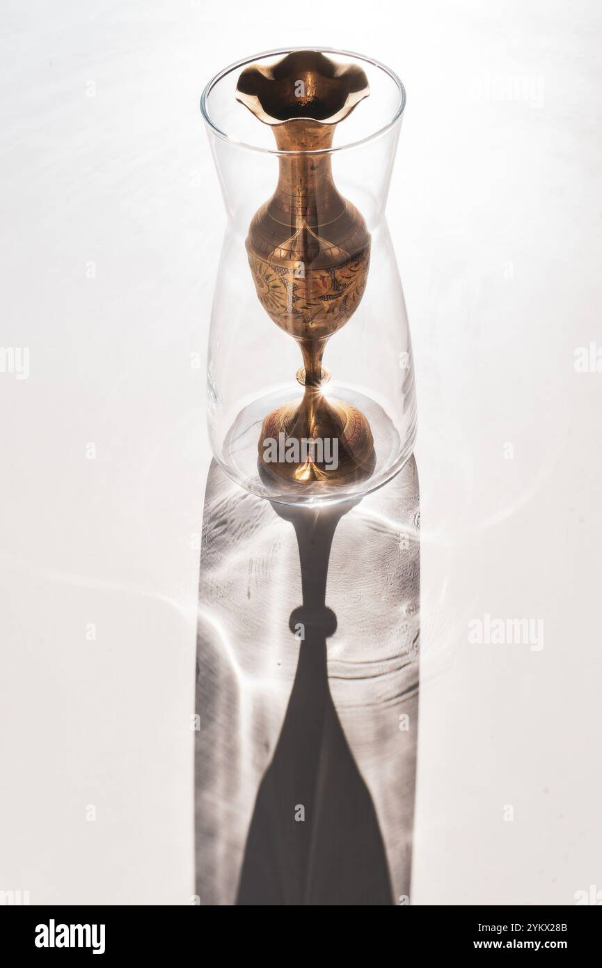 Old African vase in a modern crystal vase, a combination of old and new ...