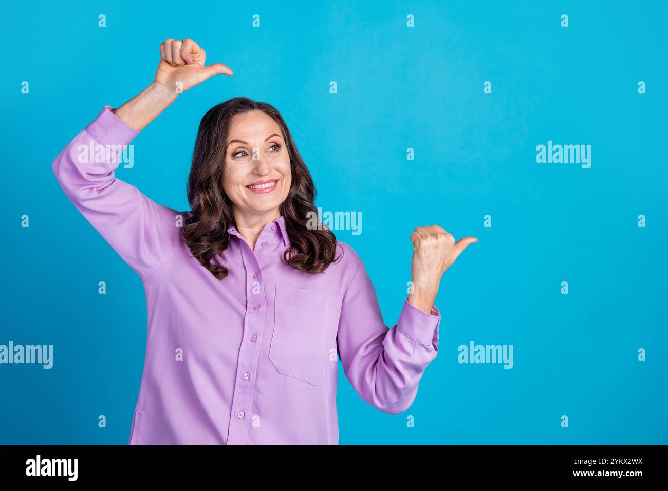 Photo of cheerful pretty lady dressed puple blouse showing two thumbs ...