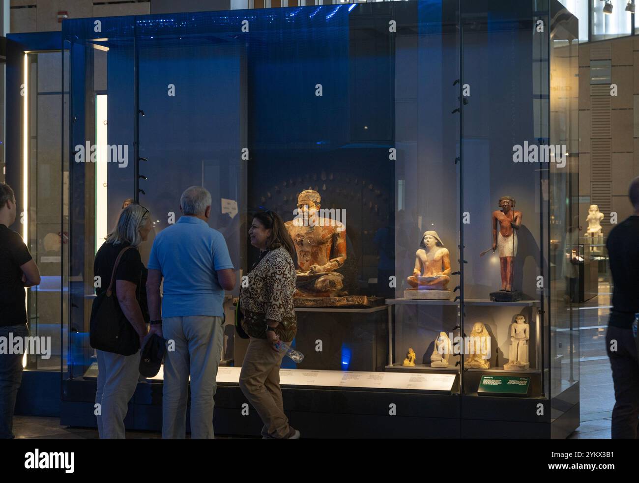 Visitors admire the limestone statue of Nefer, the King's Overseer of ...