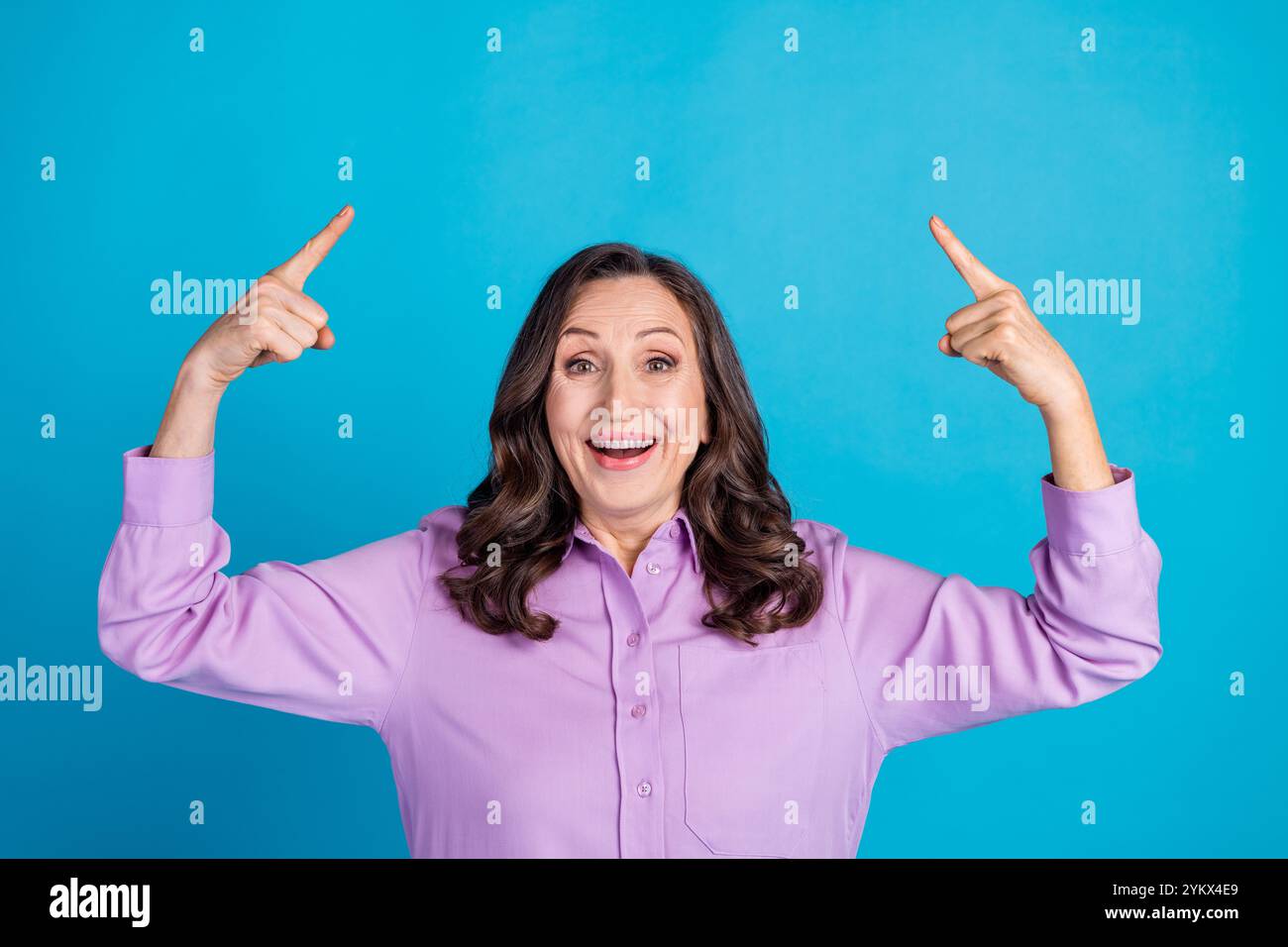 Photo of cheerful pretty lady dressed puple blouse showing two fingers ...