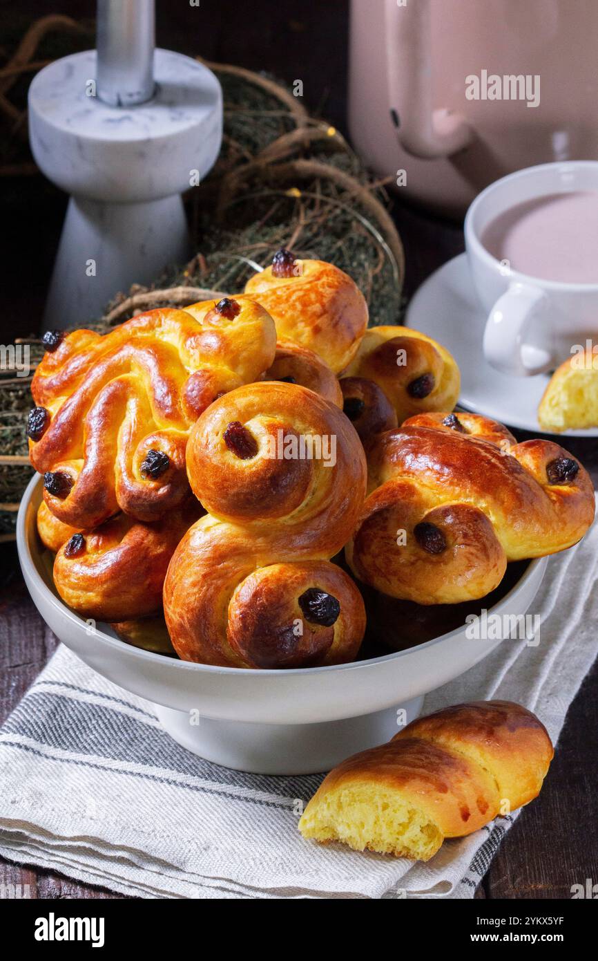 Traditional saffron Swedish buns lussekatt in different shapes, served ...