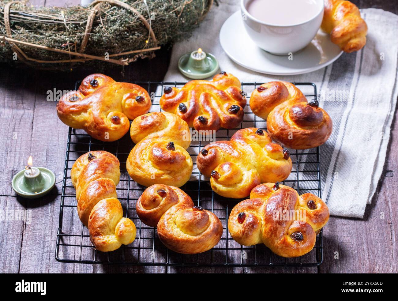 Traditional saffron Swedish buns lussekatt in different shapes, served ...