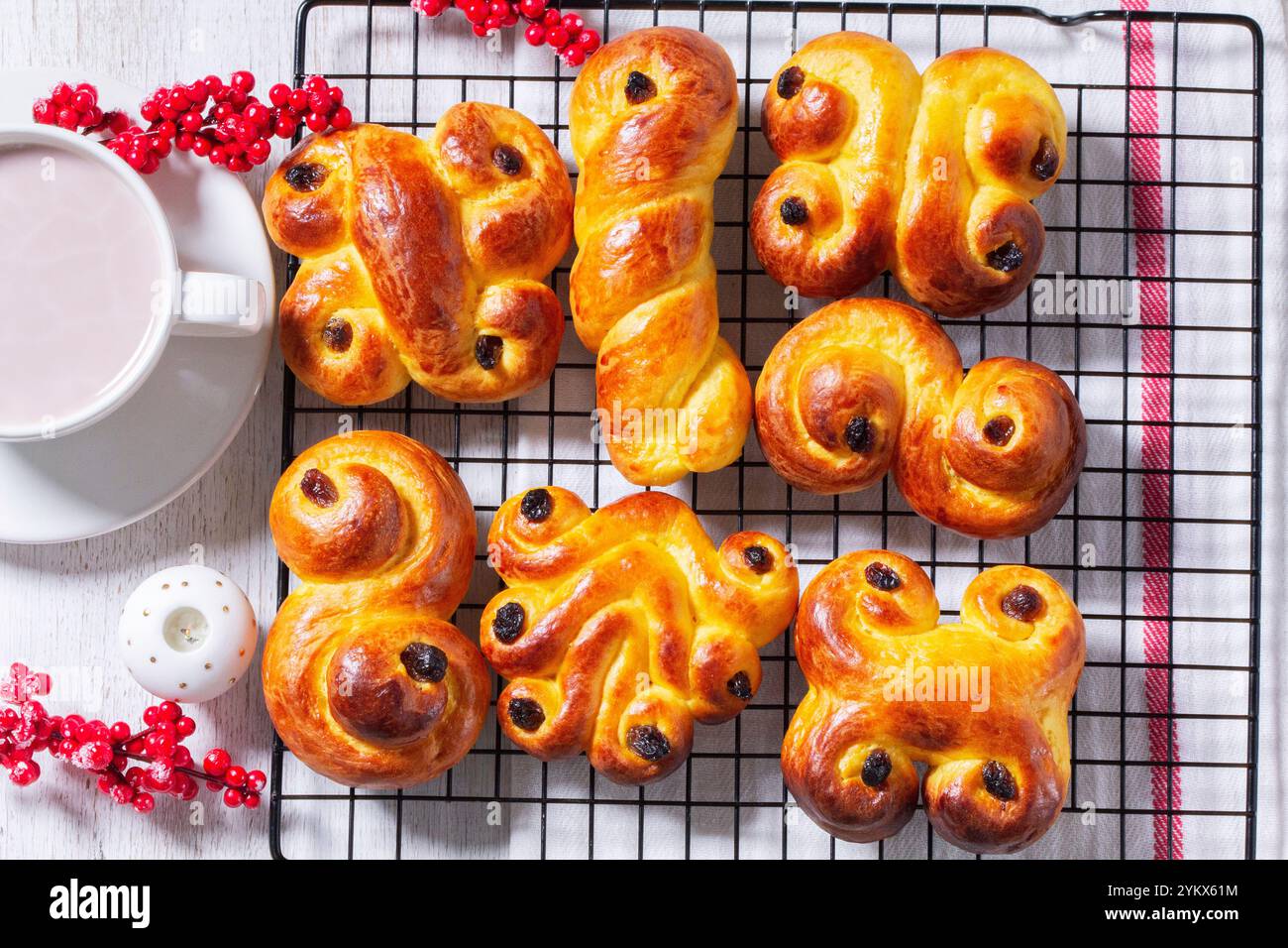 Traditional saffron Swedish buns lussekatt in different shapes, served ...