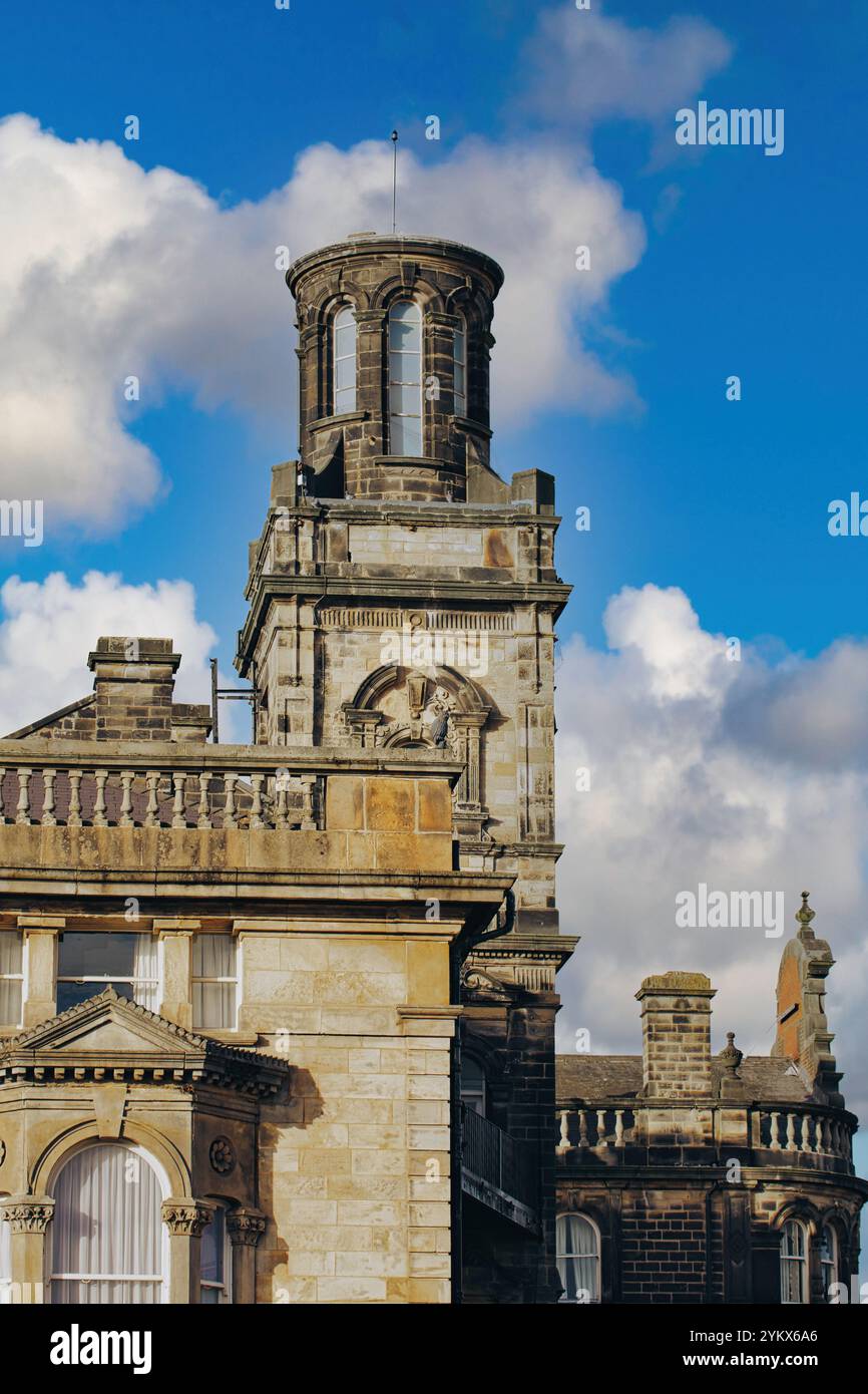 A stone building's turret and facade are prominently displayed against ...