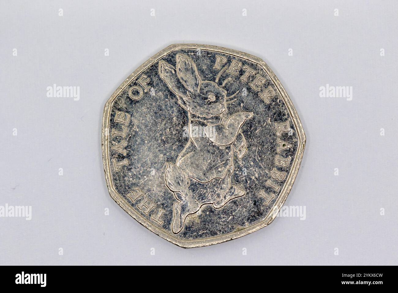 Close-up view of a silver-colored British 50 pence coin featuring Peter ...