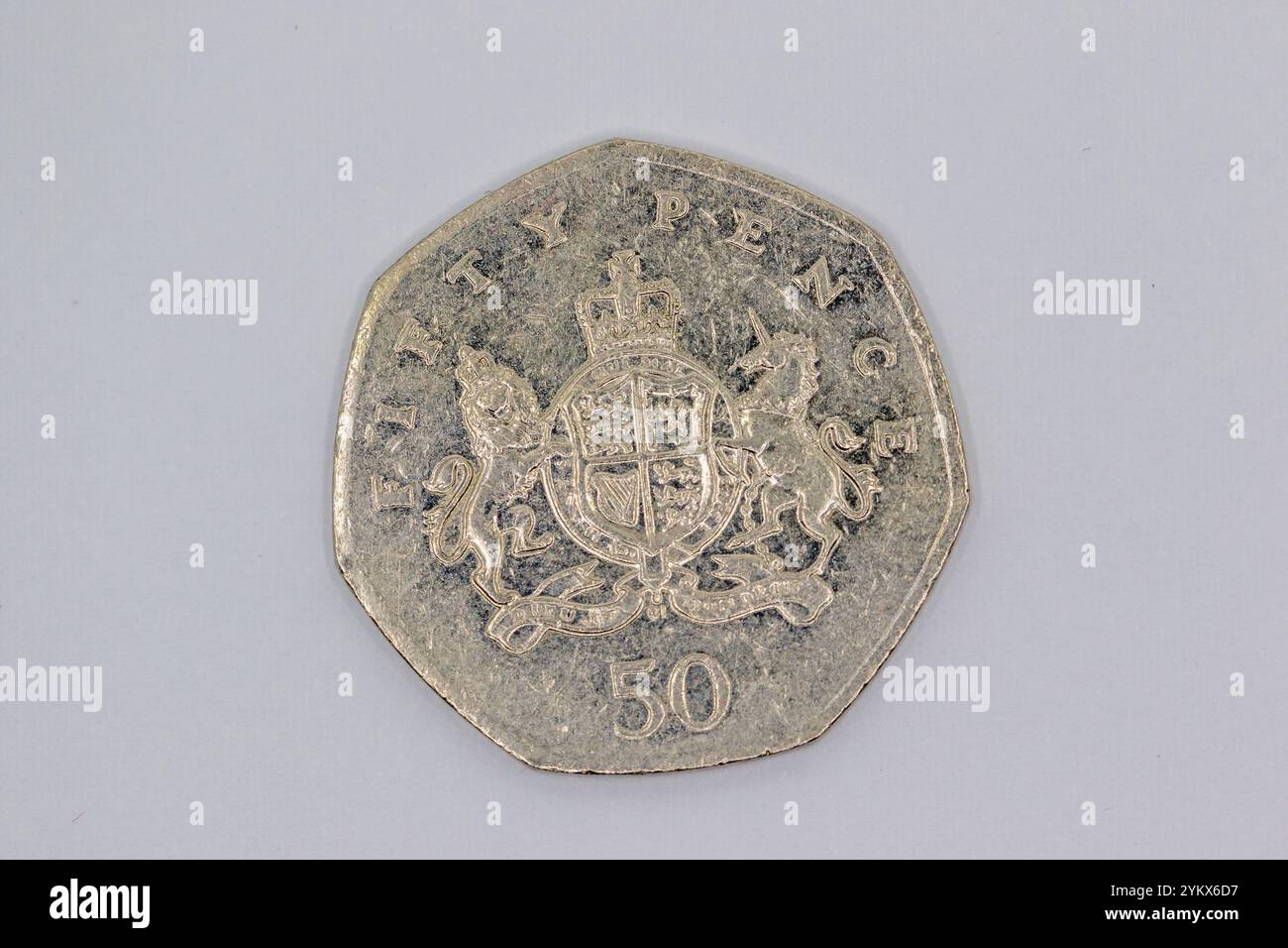 Close-up of a British fifty pence coin showing the reverse side. The ...
