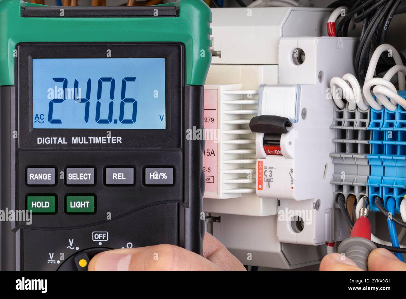 Voltage Measurement with Digital Multimeter in Electrical Panel Stock ...
