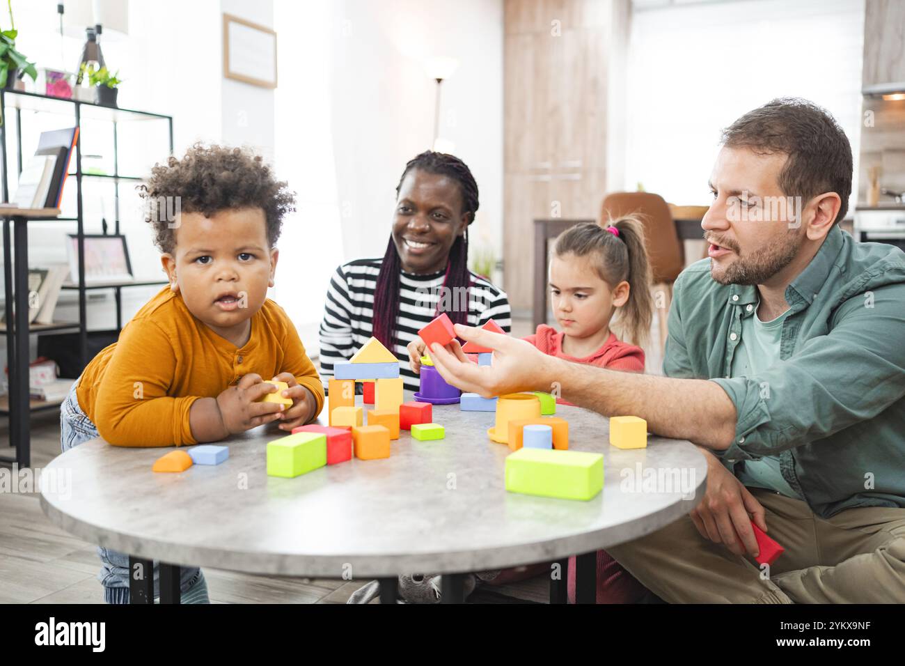 Family playing colorful blocks hi-res stock photography and images - Alamy