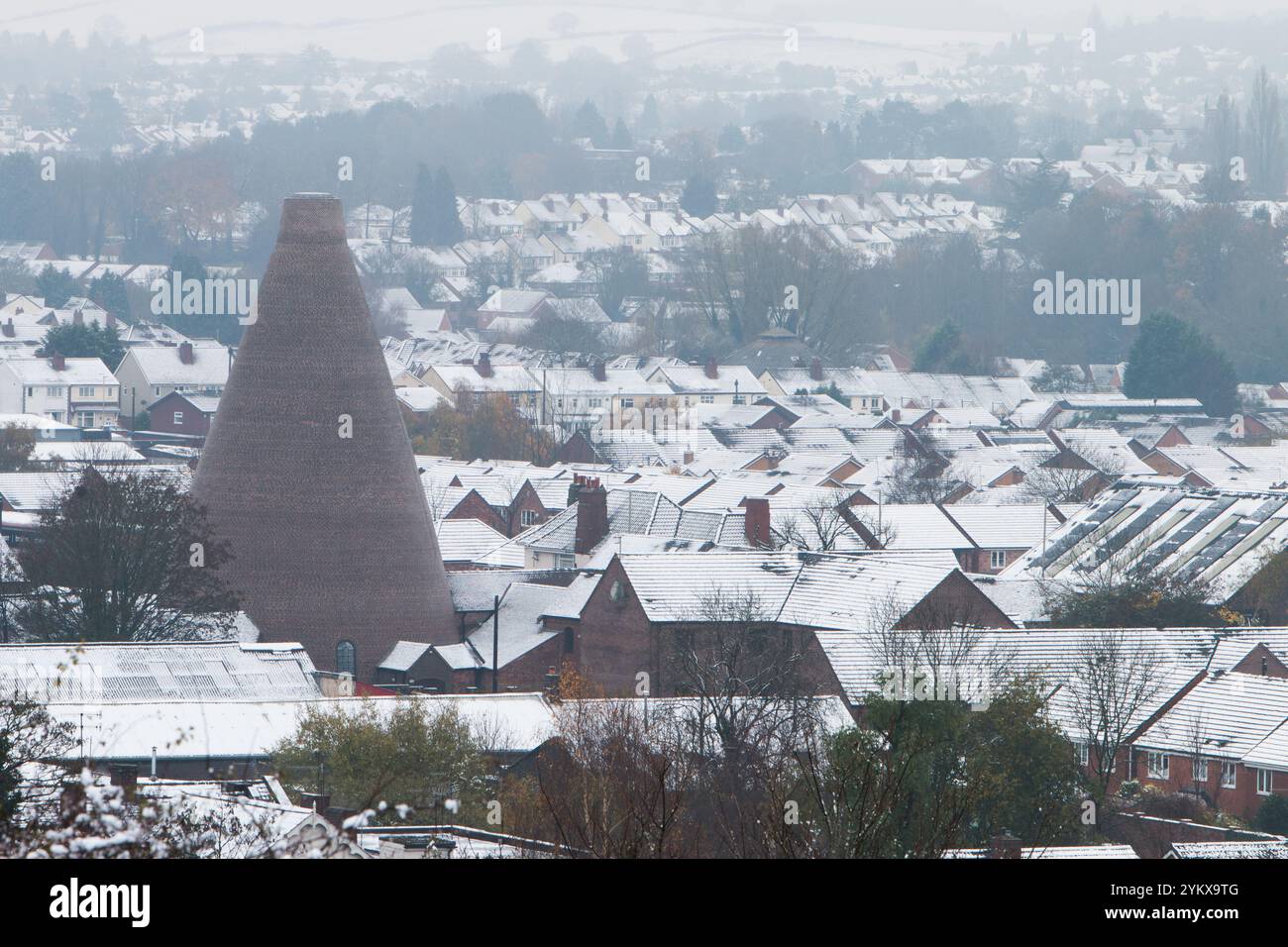Red House Glass Cone and surrounding rooftops during snow shower ...