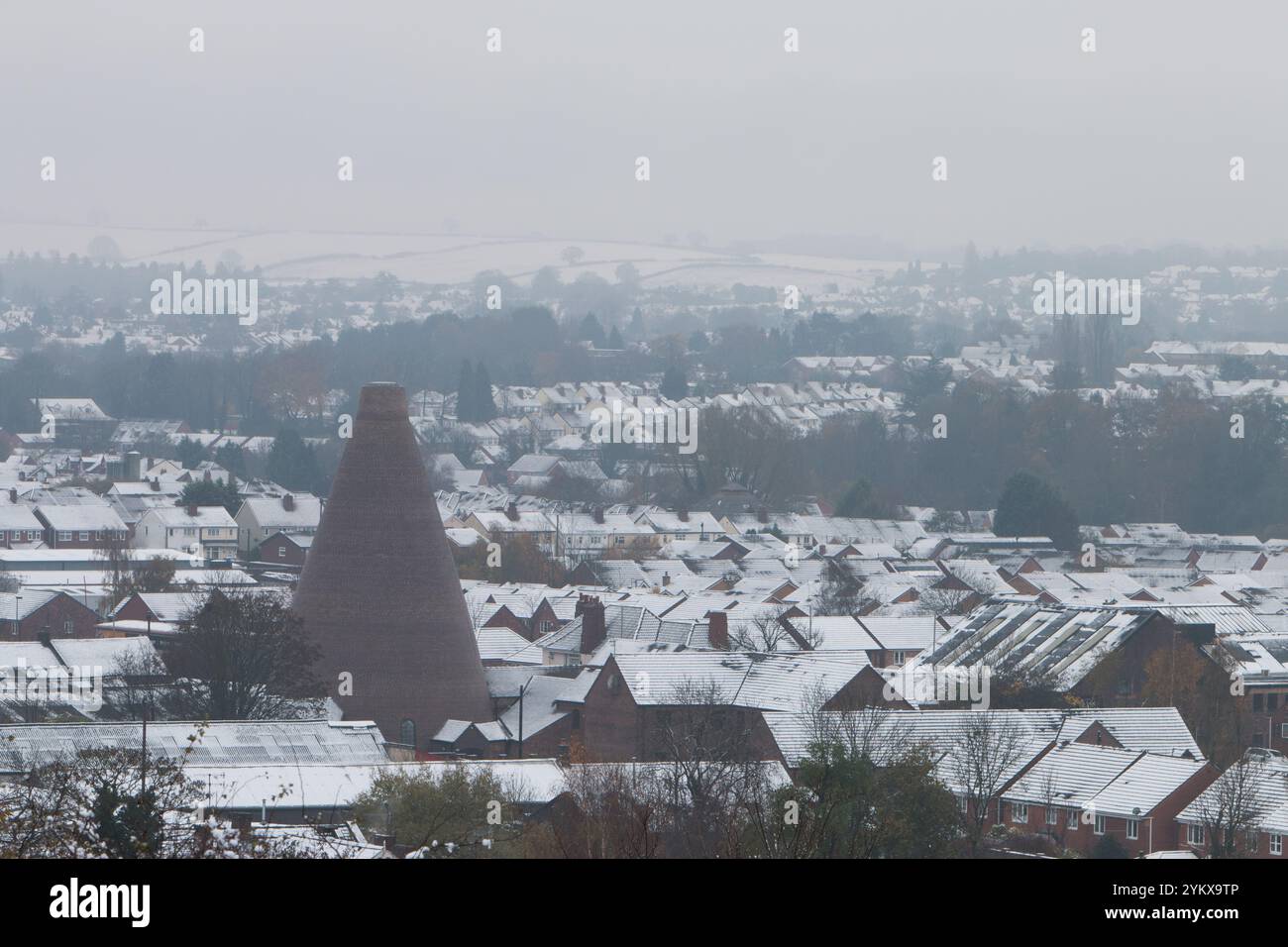 Red House Glass Cone and surrounding rooftops during snow shower ...