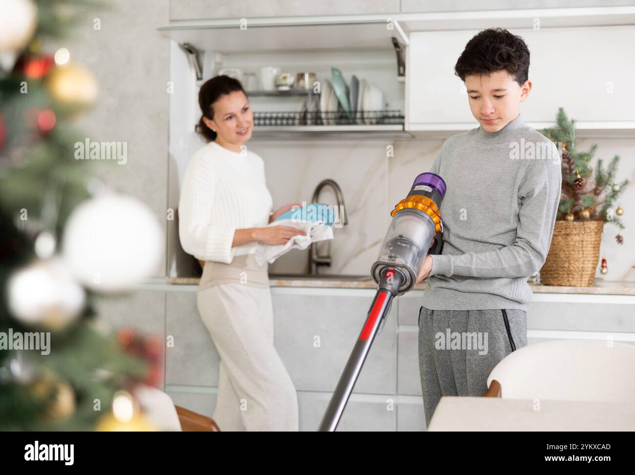 Mother and son doing household chores Stock Photo - Alamy