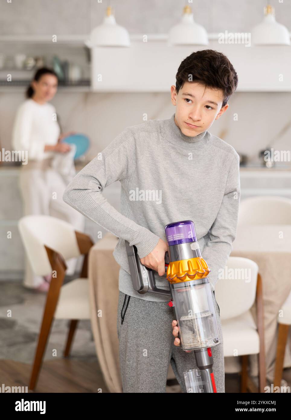 Teenager boy washing dishes hi-res stock photography and images - Alamy