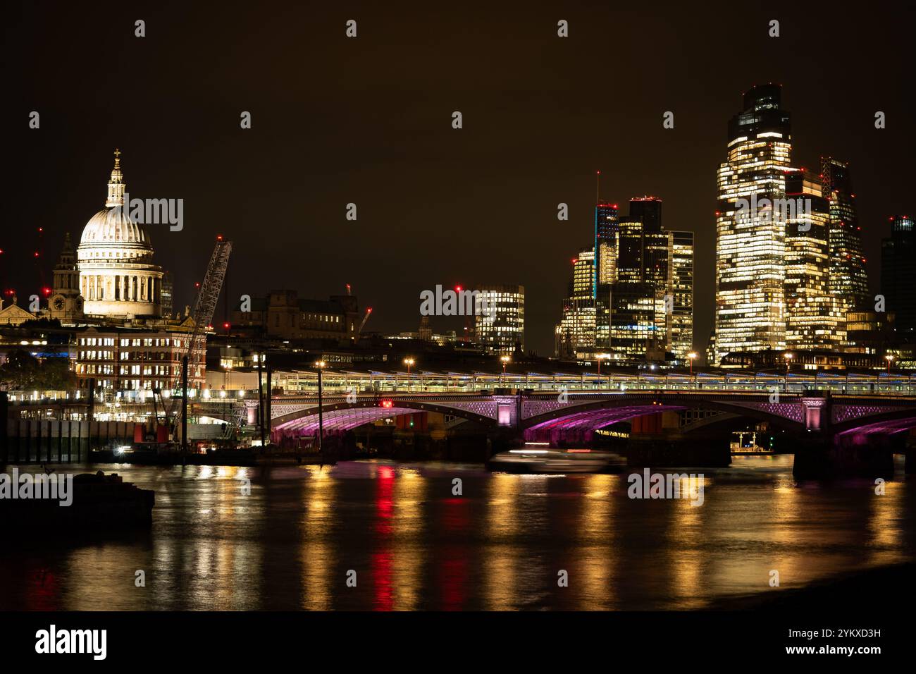 Night view of the Thames river with St. Paul's cathedral and part of ...