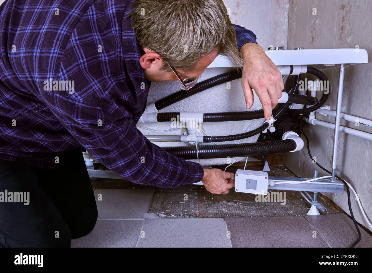 Adjusting plumbing and electrical connections wenn installing whirlpool ...