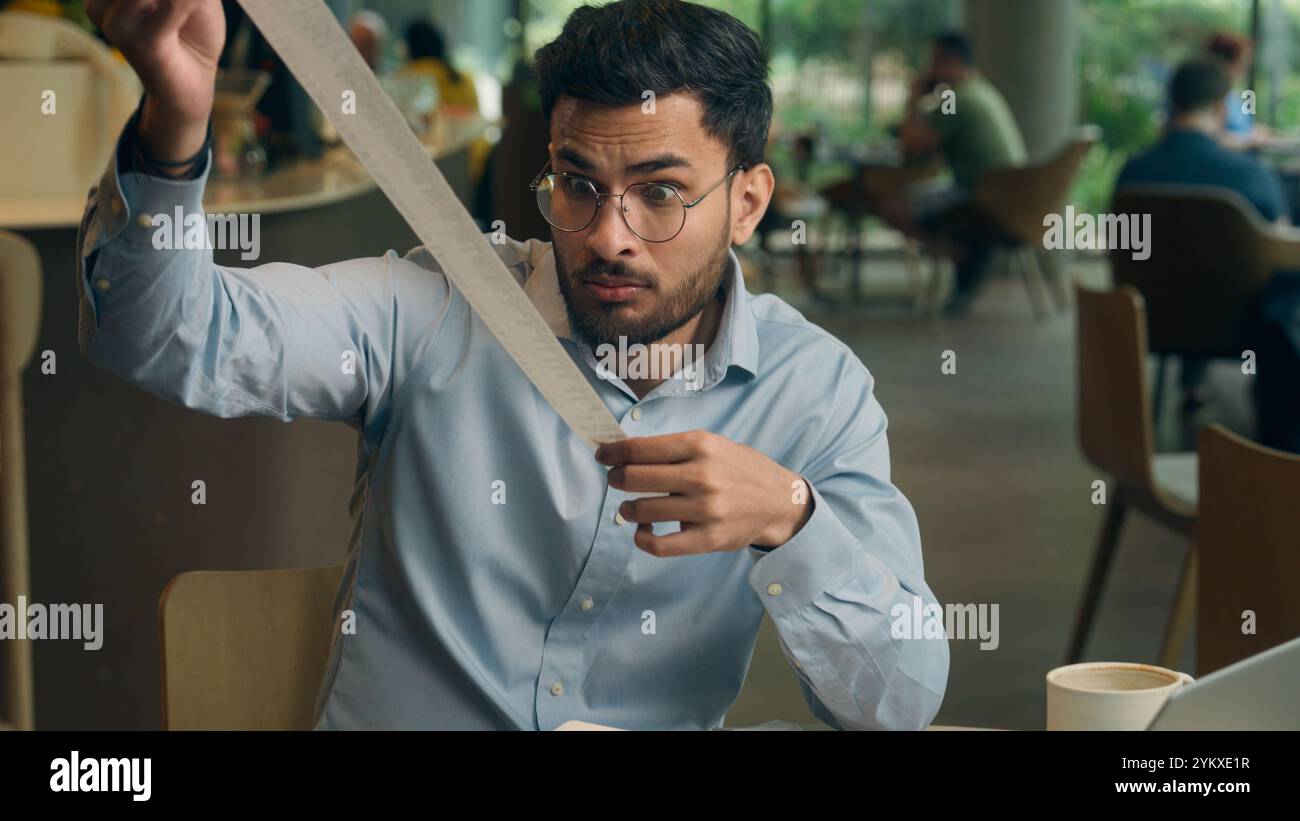 Tired freelance worker male businessman Indian Arabian man stressed ...