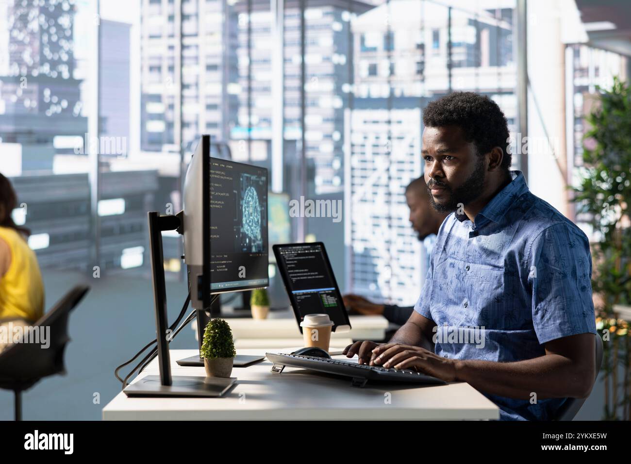 Computer scientist working with machine learning tech advancing AI critical to innovation of ...